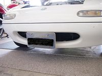 Thompson Automotive disappearing front license plate bracket